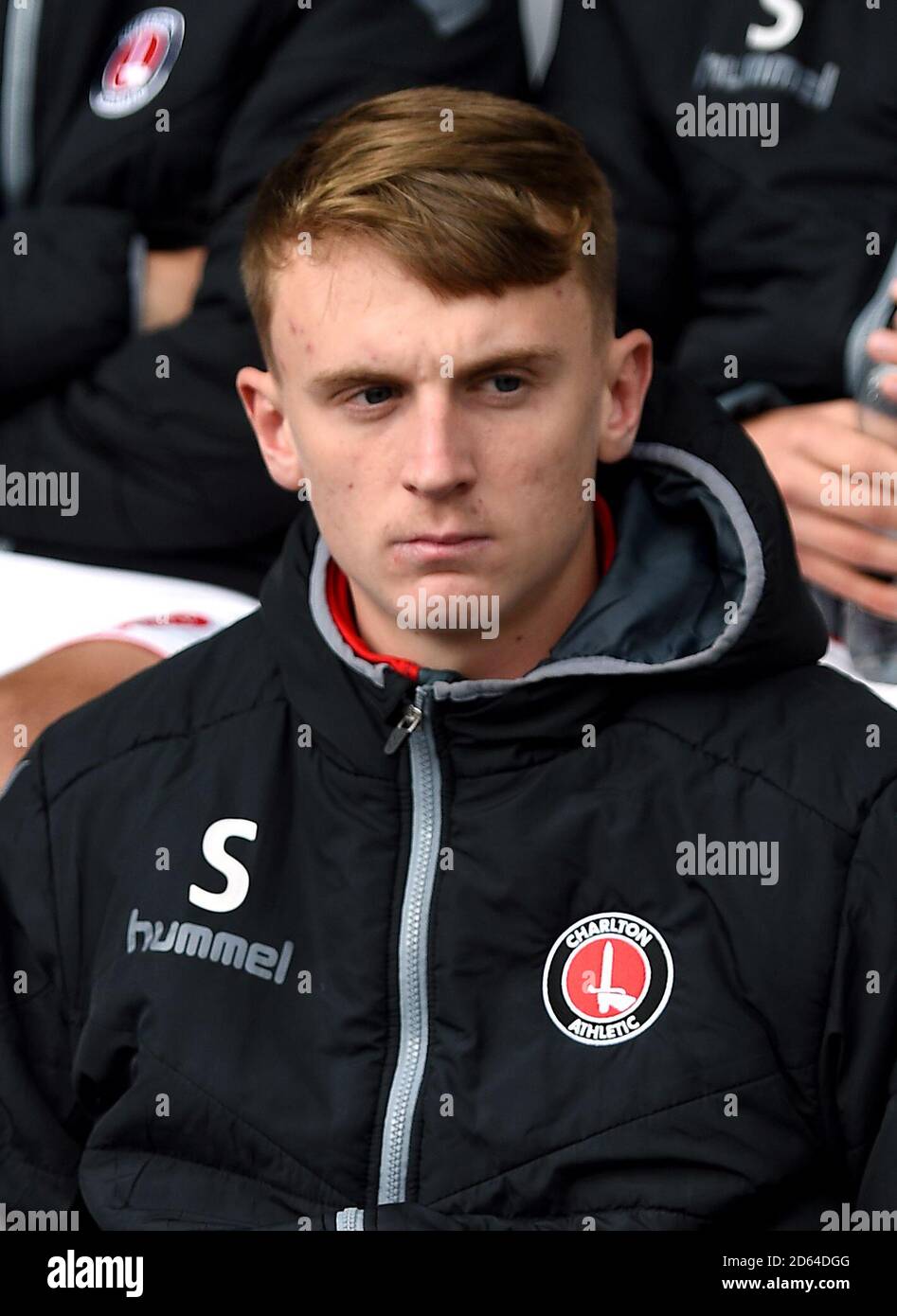 Charlton Athletic's Josh Cullen (right) looks on in the dugout Stock ...