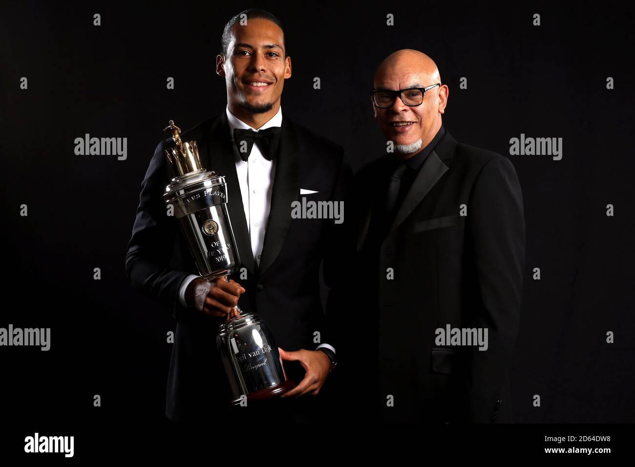 Liverpool's Virgil van Dijk poses with his PFA Player of the Year award ...