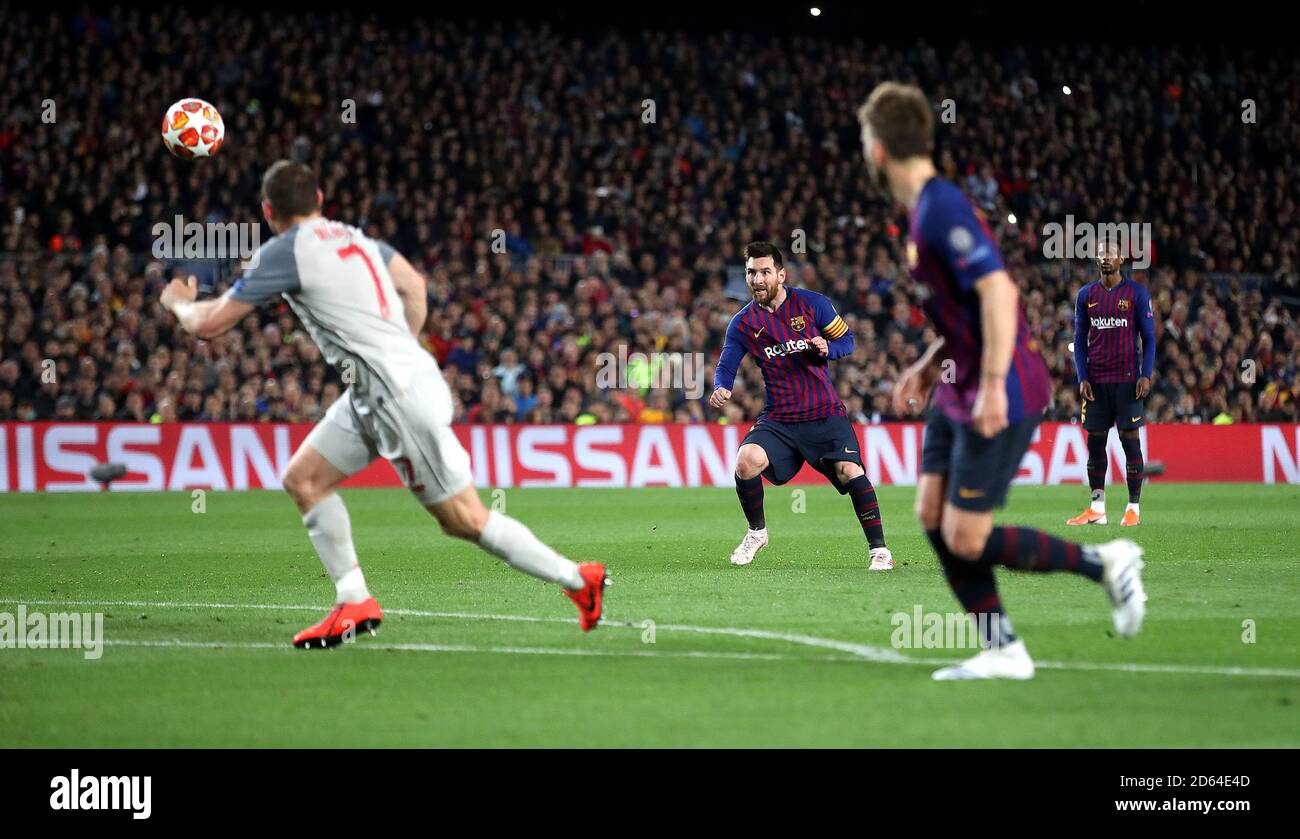 Barcelona's Lionel Messi (centre) scores his side's third goal of the ...