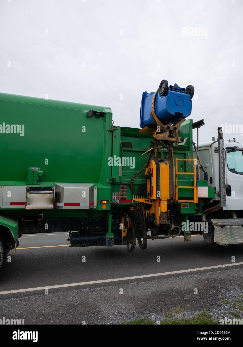 Recycling truck picking up bin Stock Photo - Alamy