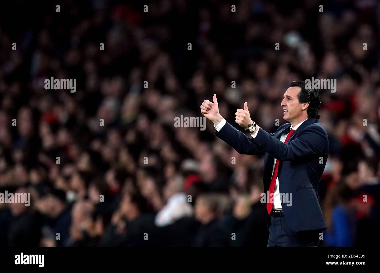 Arsenal manager Unai Emery gives a thumbs up on the touchline after his ...