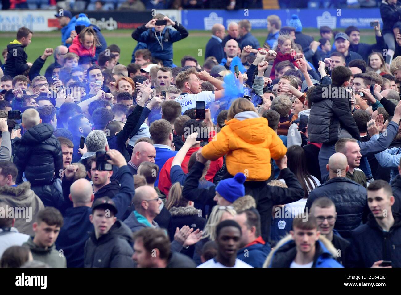 BuryÂ’'s Adam Thompson celebrates with Bury fans as they are promoted ...