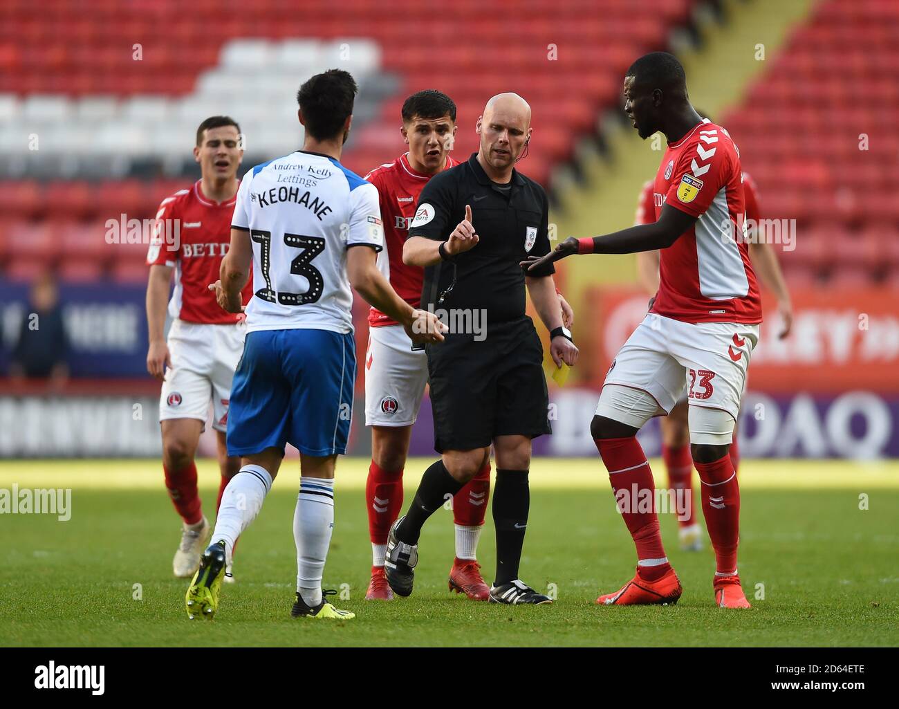 Rochdale's Jimmy Keohane is about to be shown a yellow card as Charlton ...