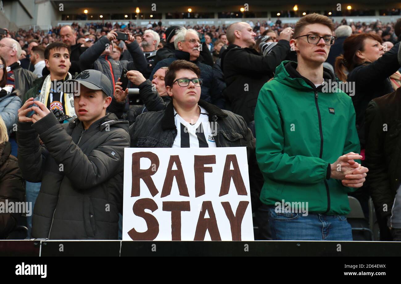 Fans in the stands holding a 'Rafa Stay' sign Stock Photo - Alamy