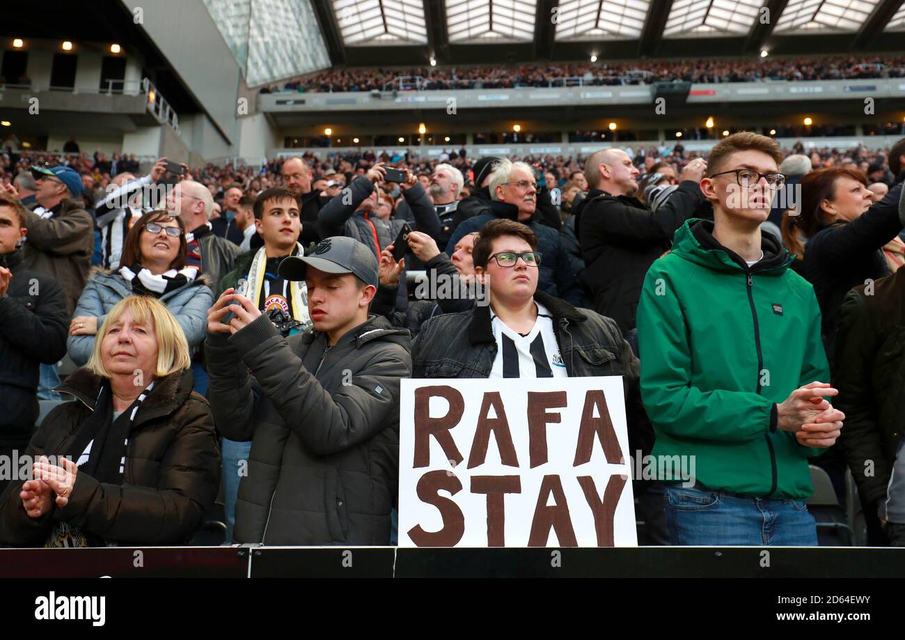 Fans in the stands holding a 'Rafa Stay' sign Stock Photo - Alamy