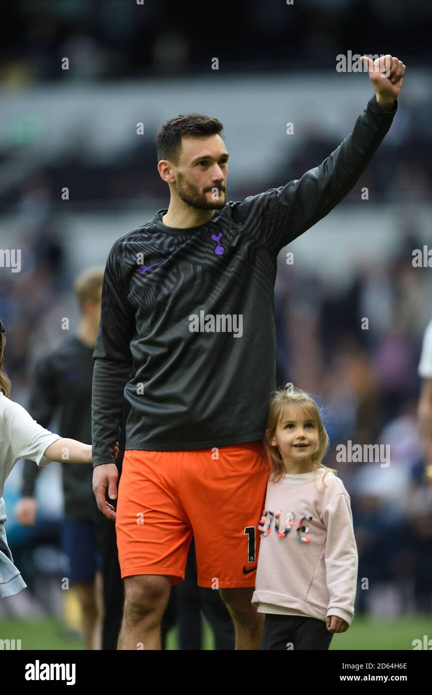 Tottenham Hotspur goalkeeper Hugo Lloris and his family on the lap of ...