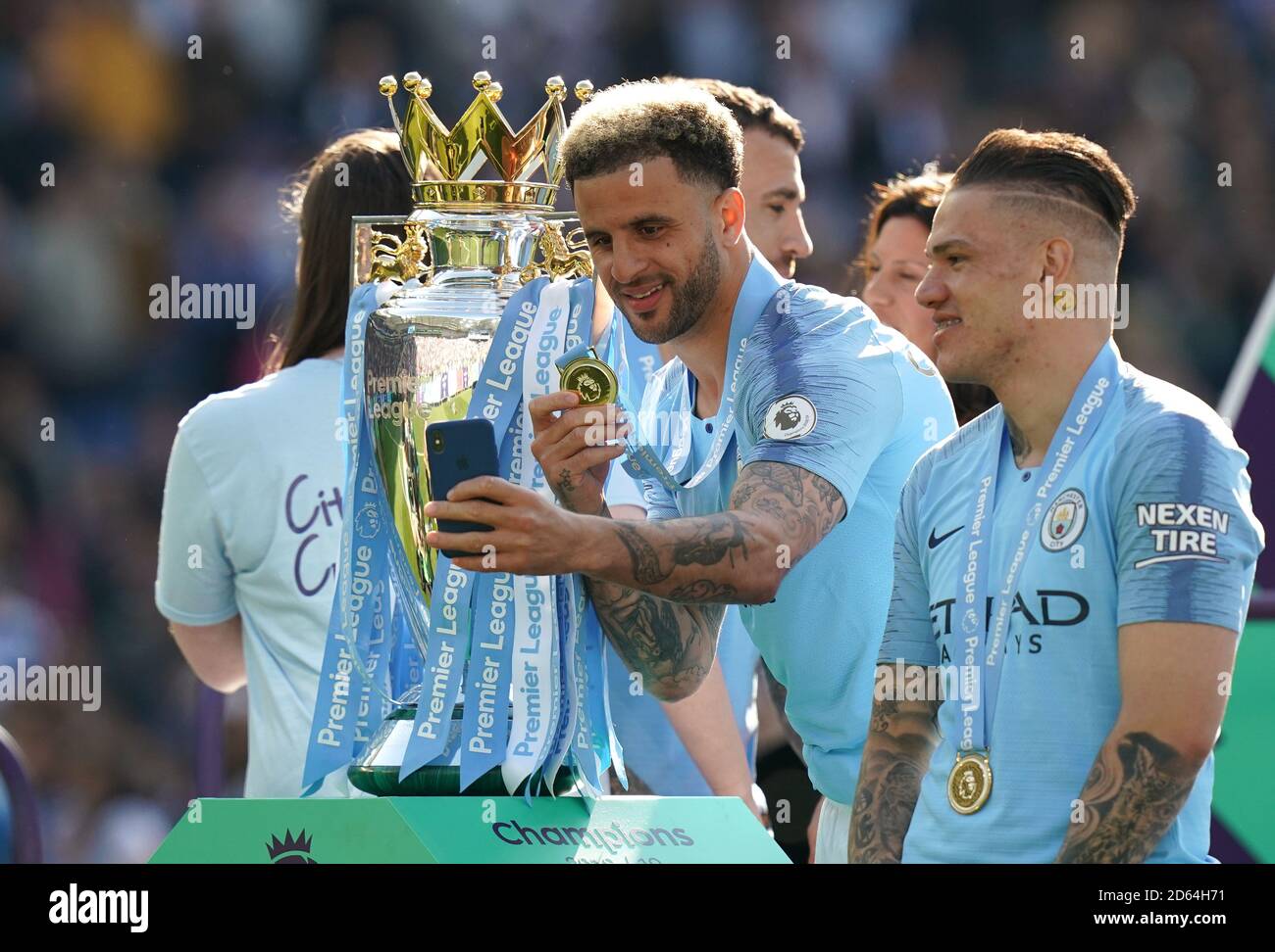 Manchester City's Kyle Walker takes a selfie with the trophy after the ...