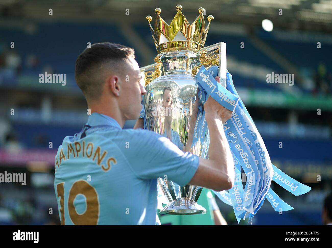 Manchester City's Phil Foden celebrates with the trophy after the match ...