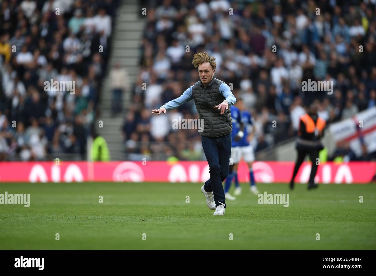 A pitch invader runs onto the pitch Stock Photo - Alamy
