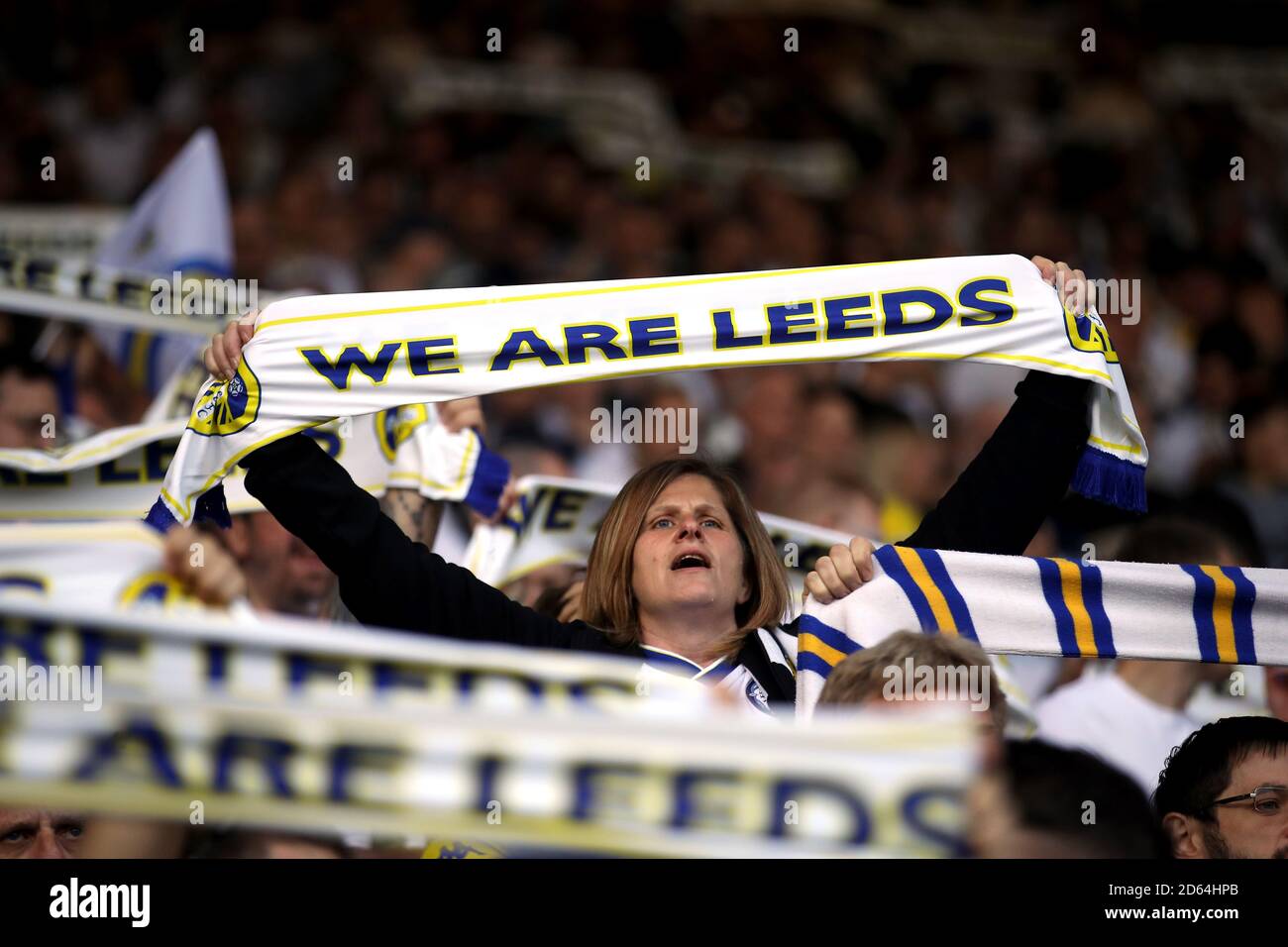 Leeds United fan holding a 'We Are Leeds' scarf before the game Stock ...