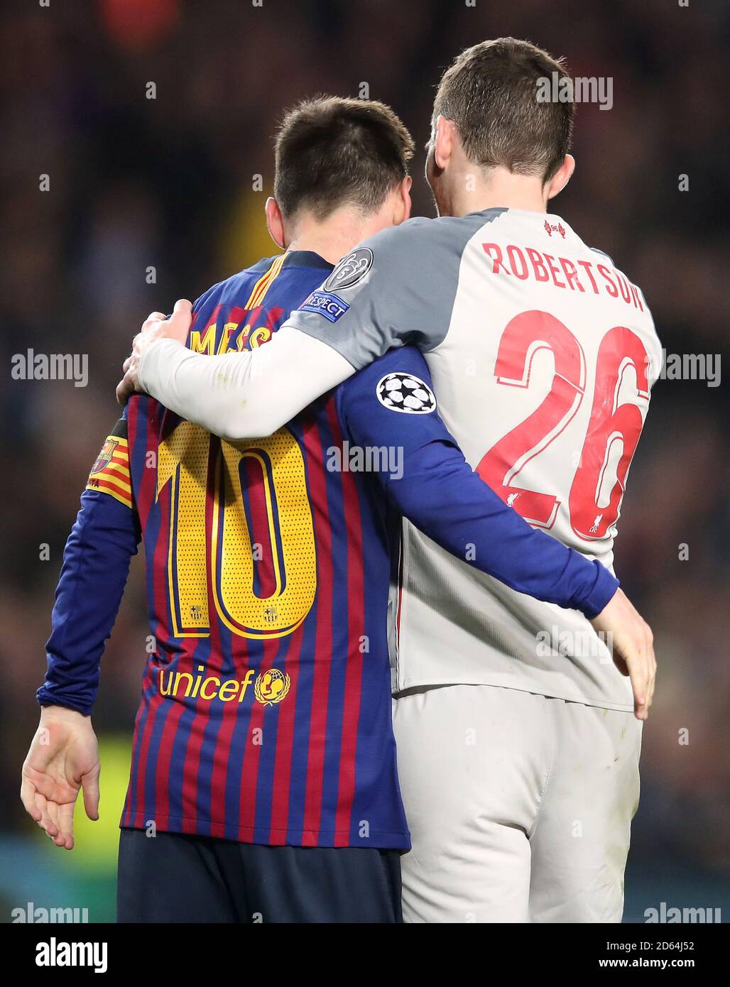 Barcelona's Lionel Messi (left) and Liverpool's Andrew Robertson after ...