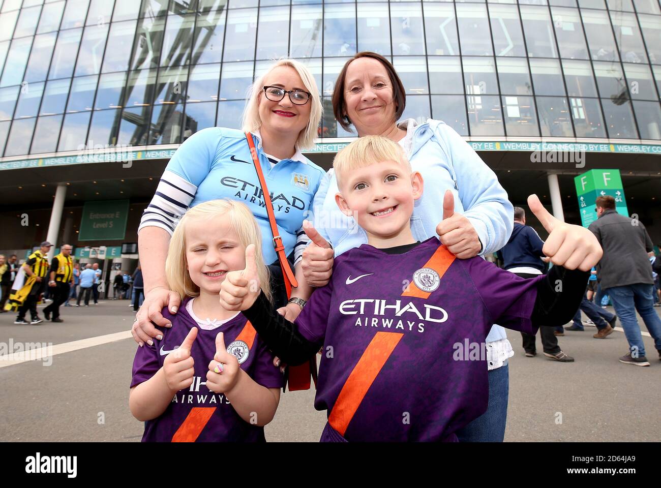 Manchester City fans pose for a photograph outside of Wembley Stadium ...