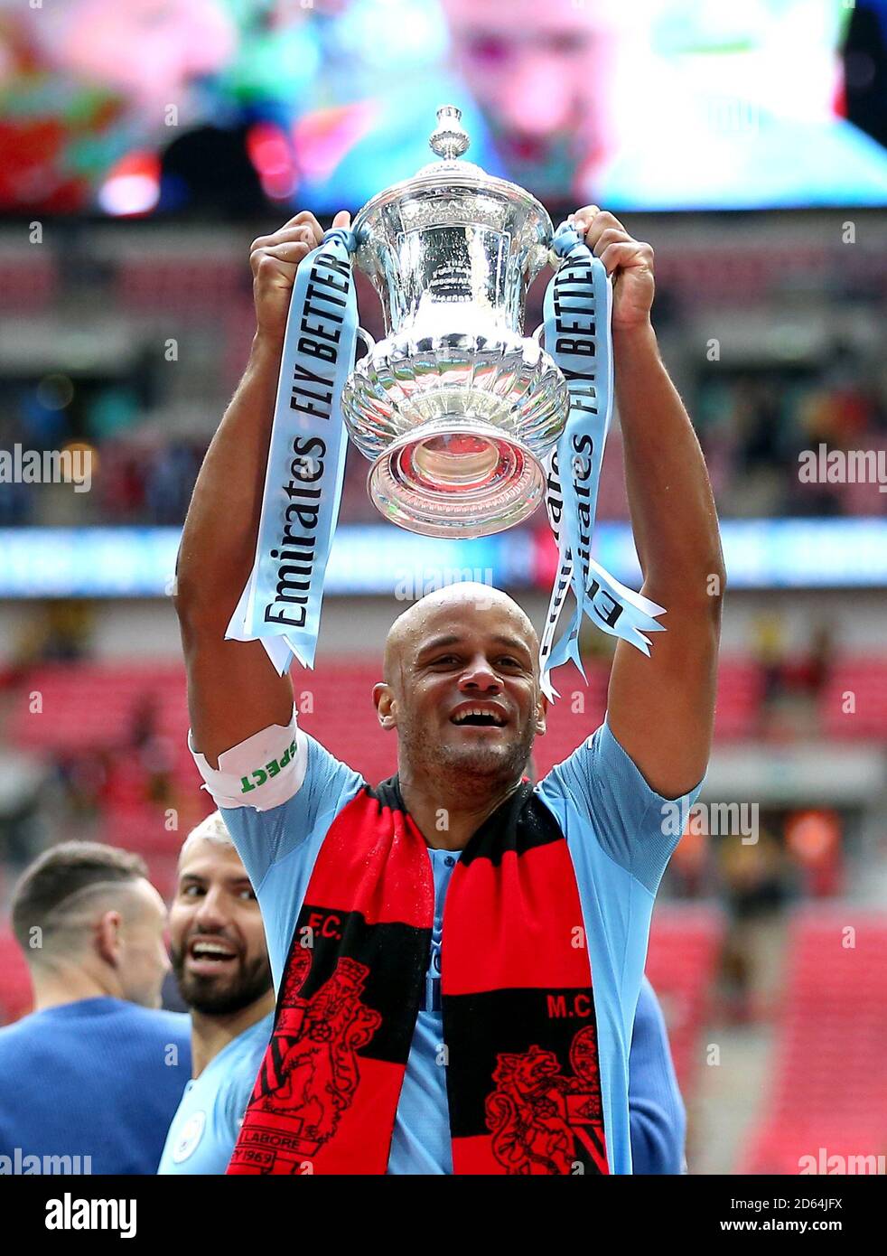 Manchester City's Vincent Kompany celebrates with the trophy after ...