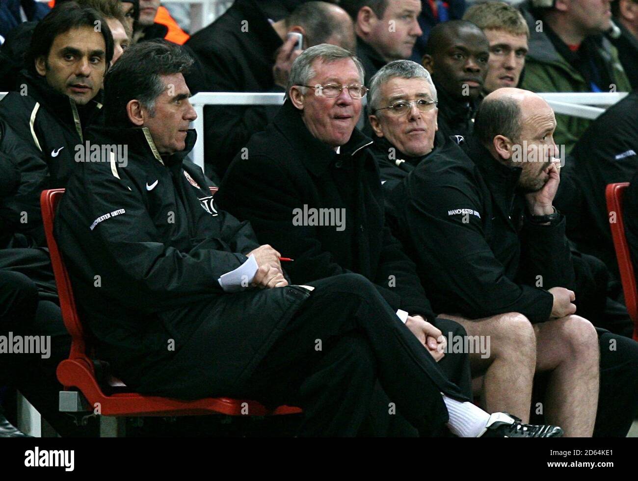 Manchester United manager Alex Ferguson sits in the dugout Stock Photo ...
