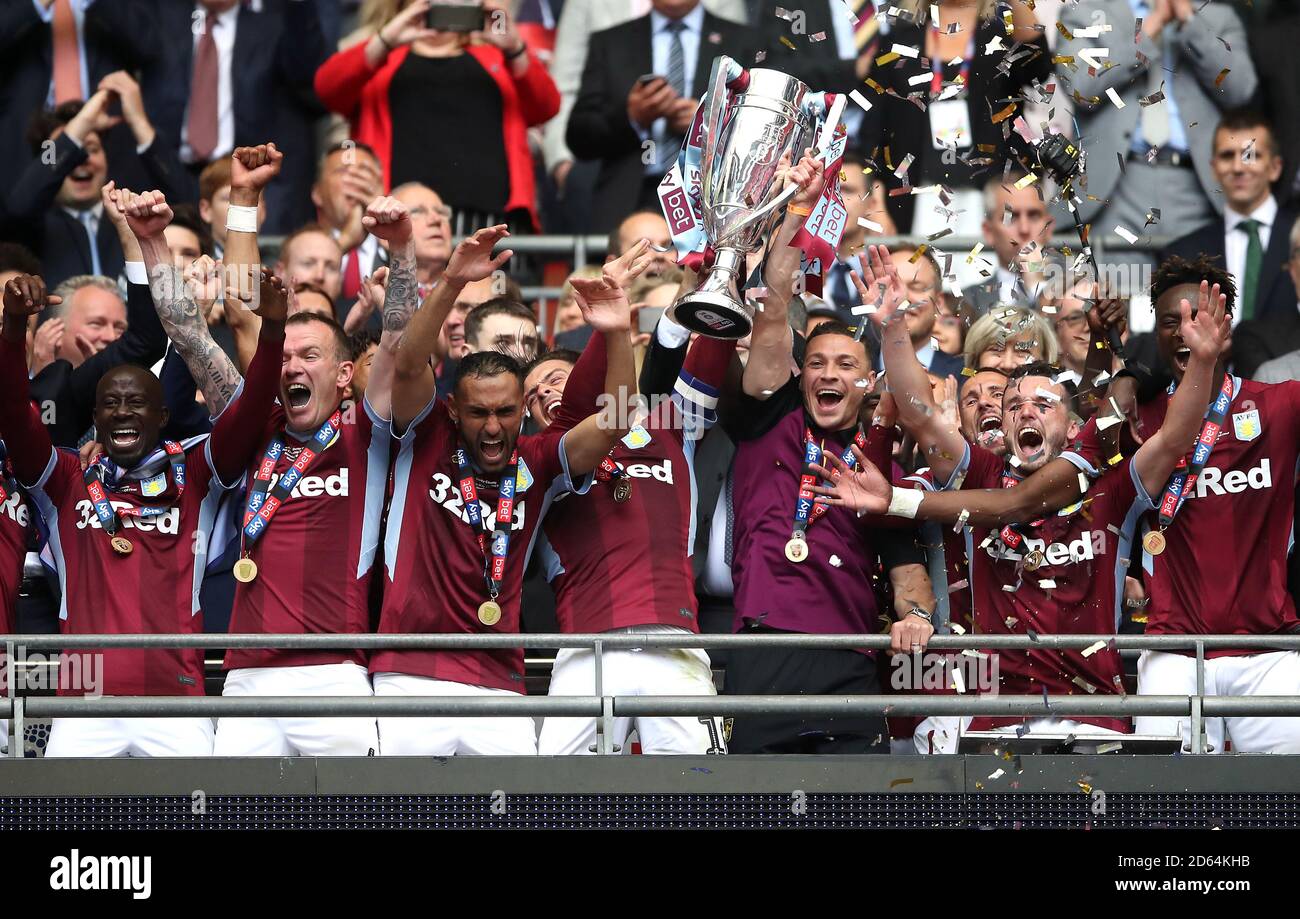 Aston Villa's Jack Grealish (centre) lifts the Sky Bet Championship ...