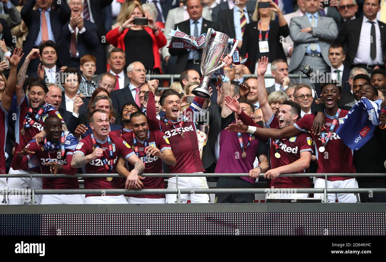 Aston Villa's Jack Grealish (centre) lifts the Sky Bet Championship ...