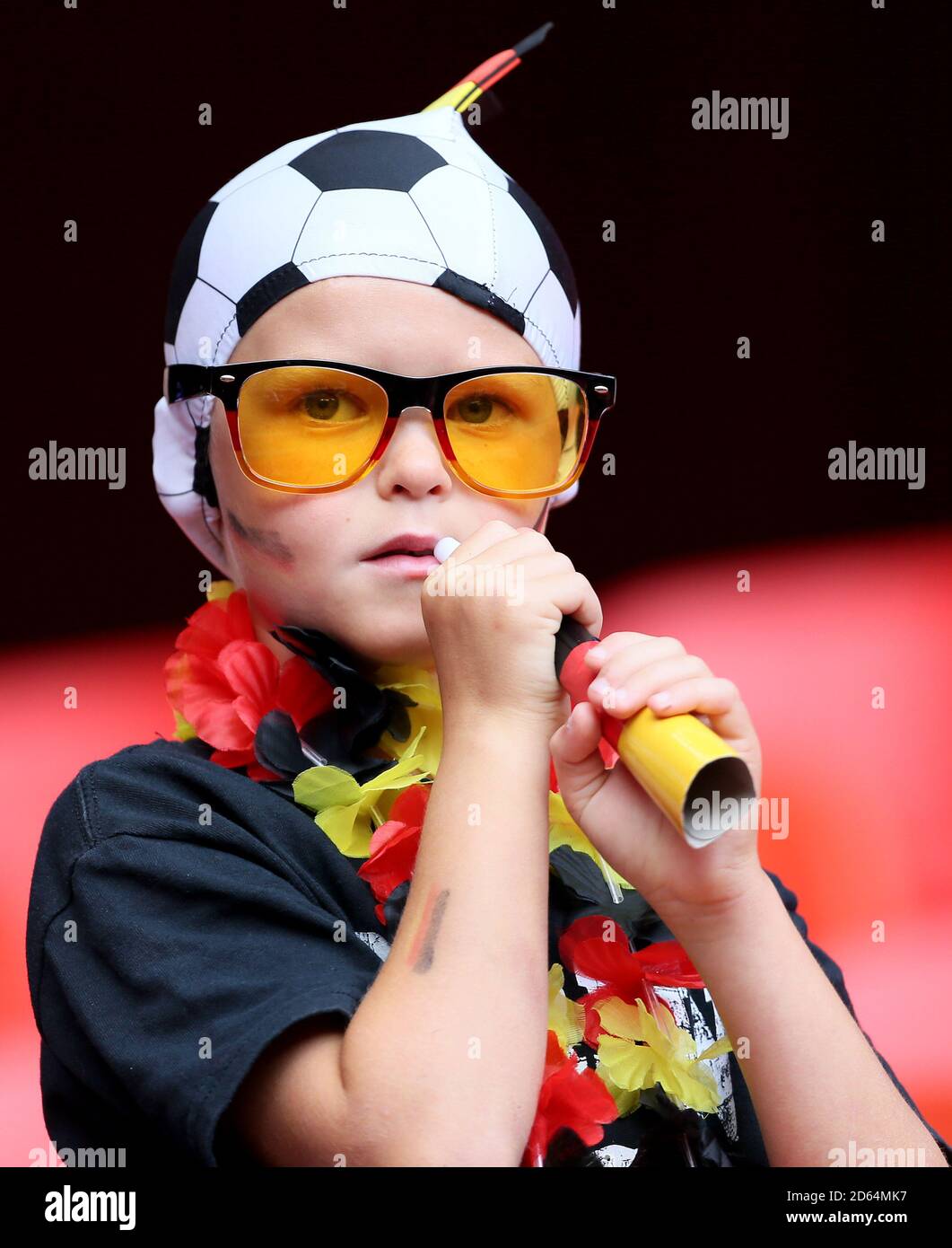 A young Germany fan shows support for their team in the stands Stock ...