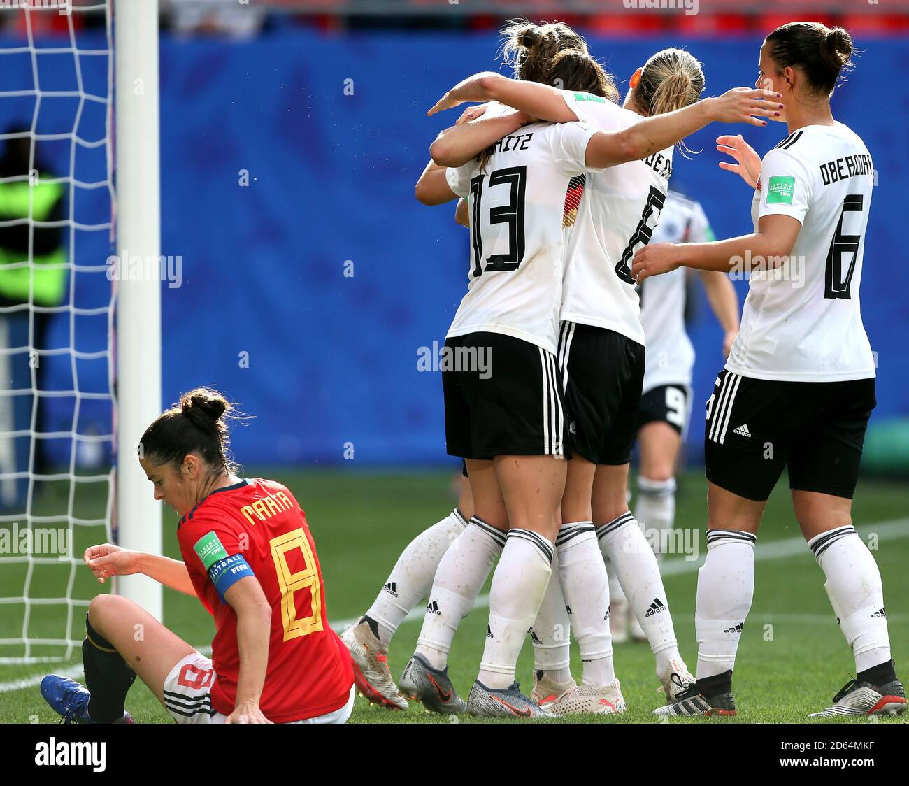 Germany's Sara Daebritz (left) celebrates scoring her side's first goal ...