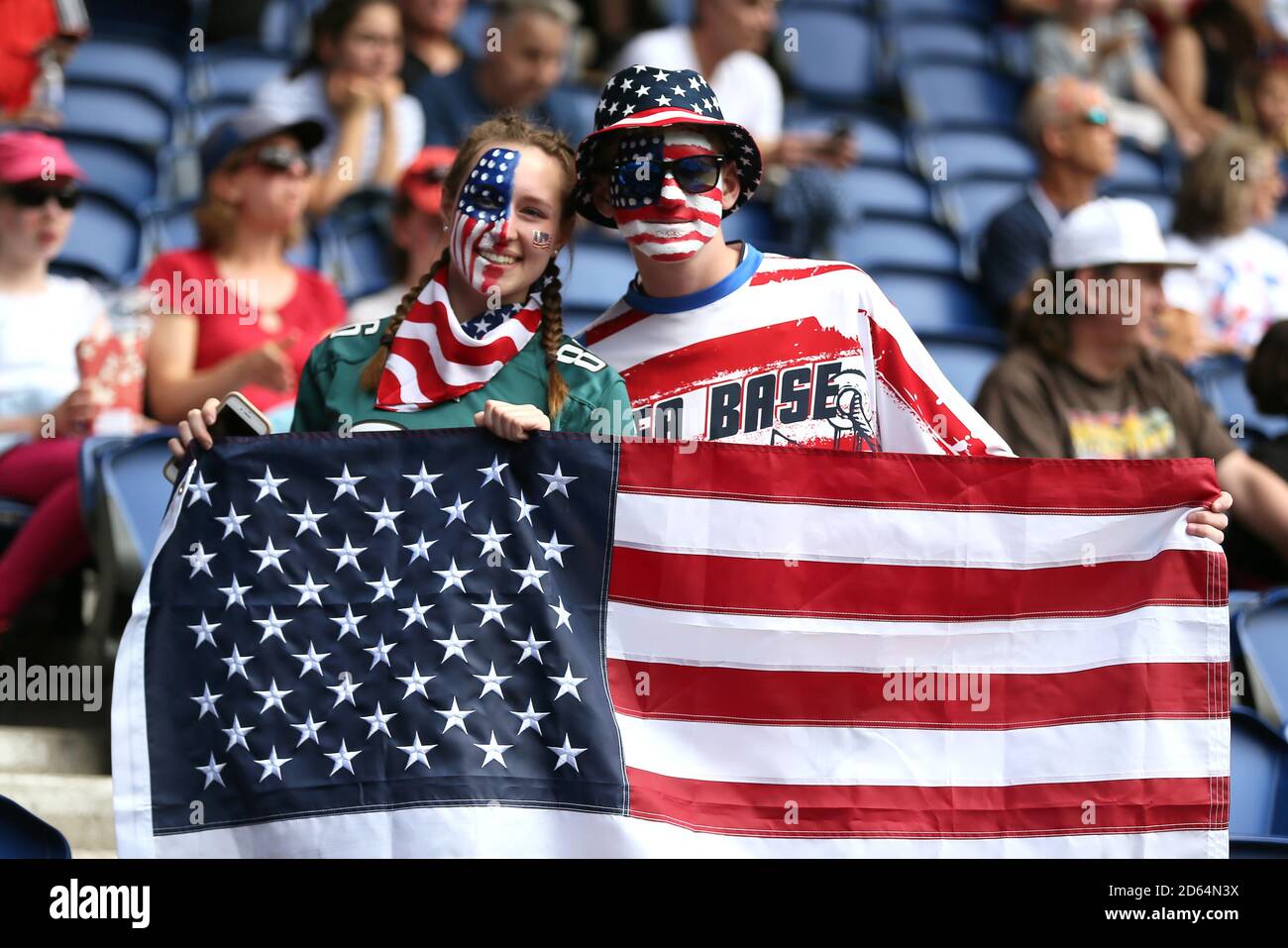 United States fans hold a United States flag in the stands ahead of the ...