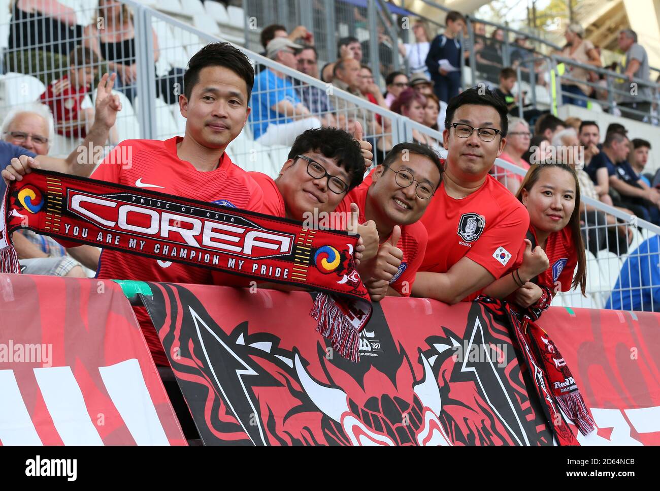 South Korea fans pose with a South Korean Scarf ahead of the match ...