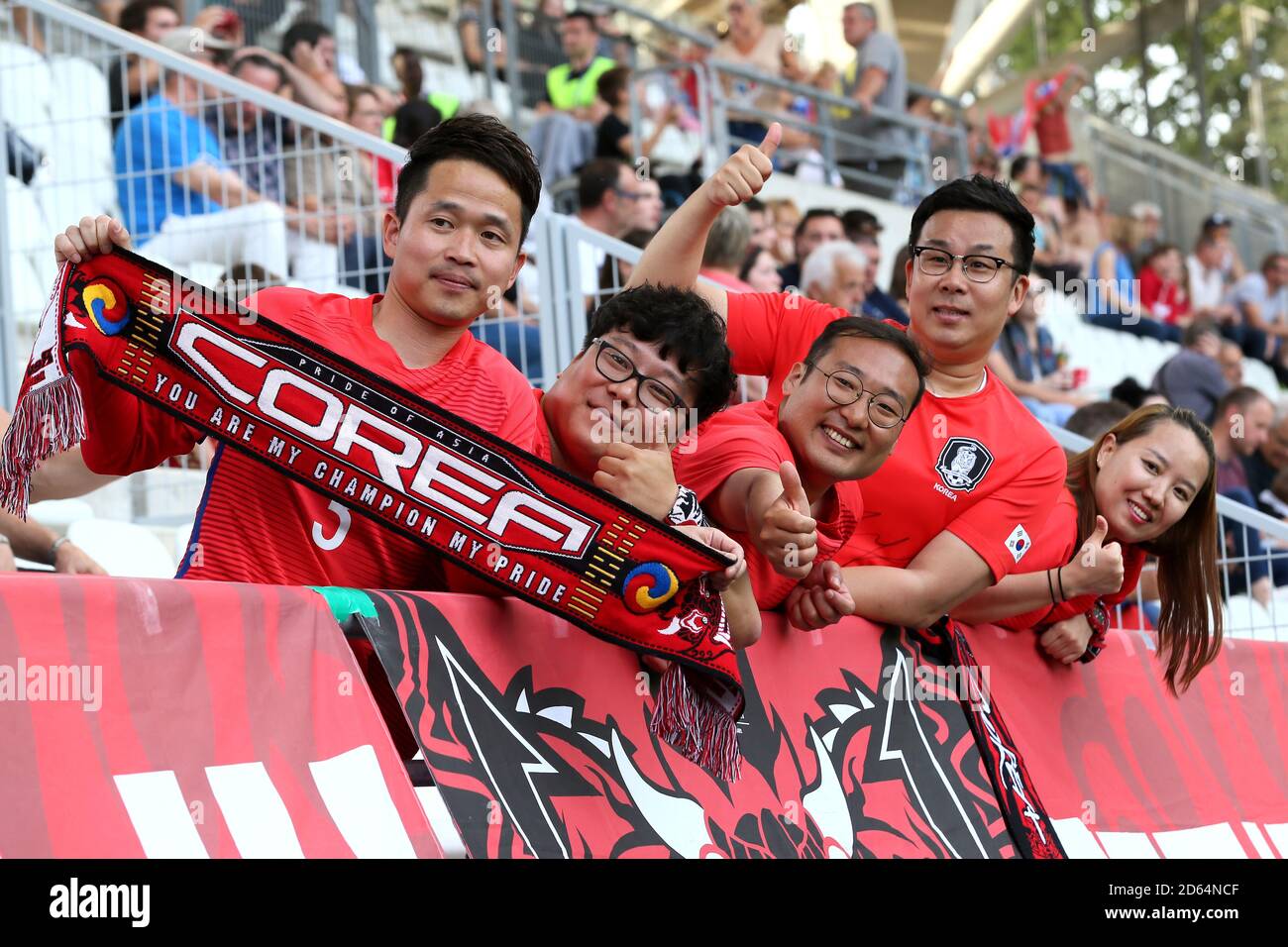 South Korea fans pose with a South Korean Scarf ahead of the match ...