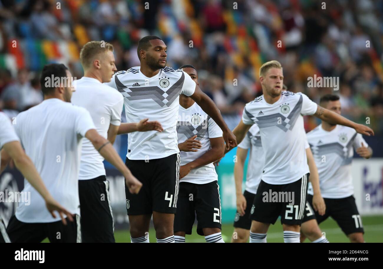 Germany's Jonathan Tah, Benjamin Henrichs and Arne Maier warm up Stock ...