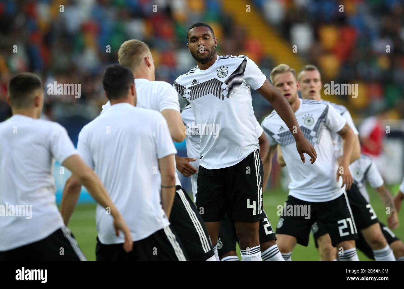 Germany's Jonathan Tah, Benjamin Henrichs and Arne Maier warm up Stock ...