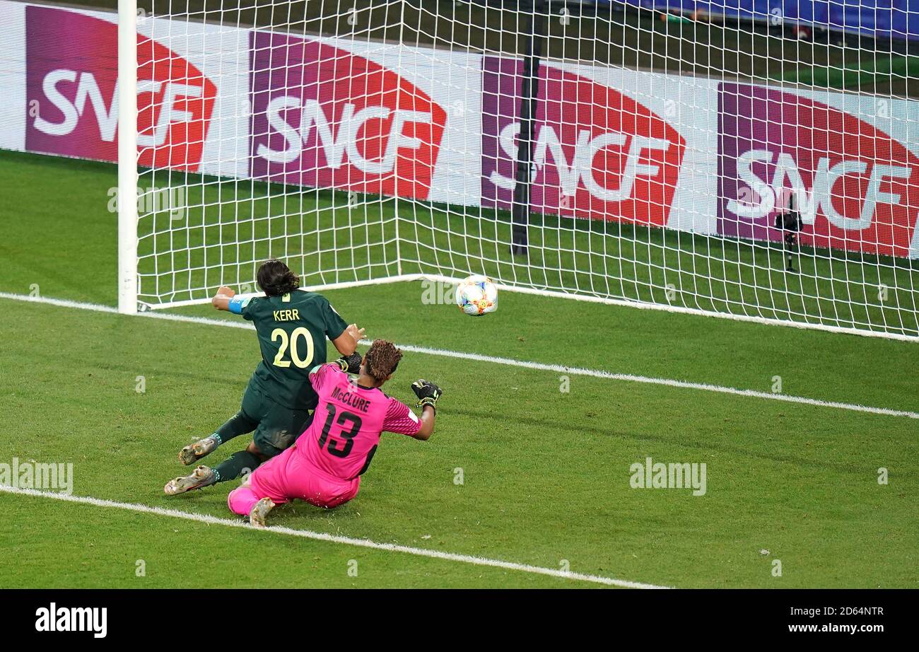 Australia's Sam Kerr (left) scores her side's fourth goal of the game ...