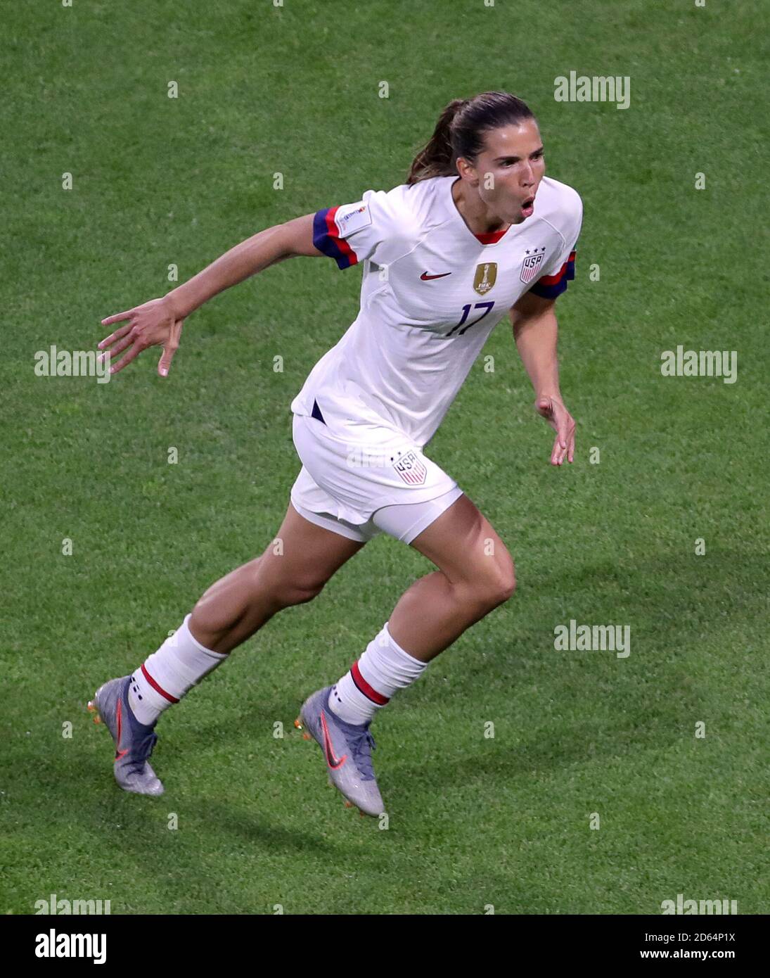 USA's Tobin Heath (right) celebrates after her effort is turned in by ...