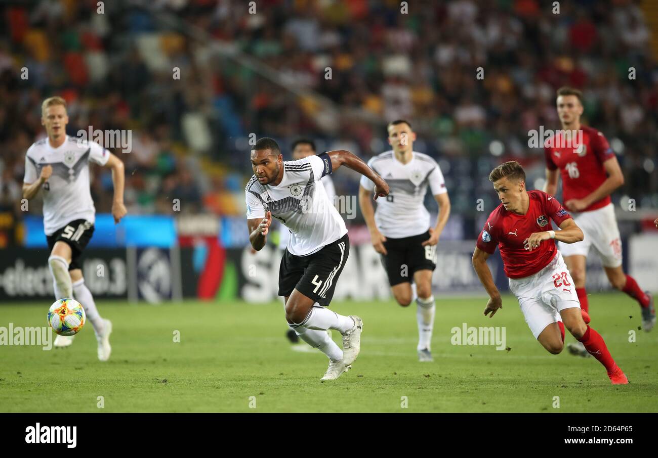 Germany's Jonathan Tah (left) and Austria's Christoph Baumgartner ...