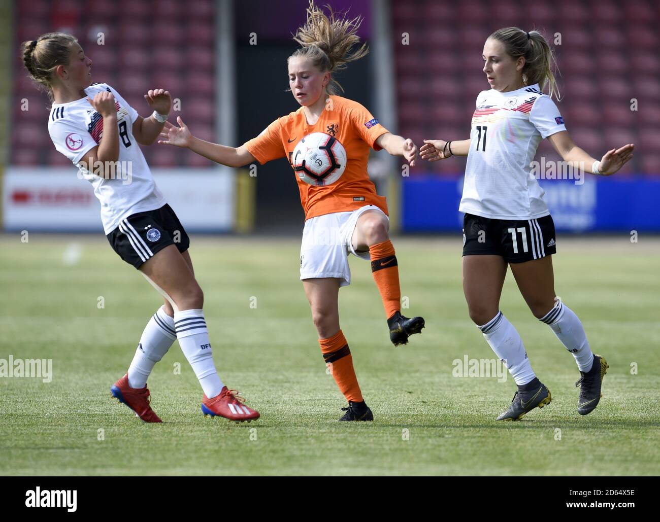 Germany's Leonie Koster and Gina-Maria Chmielinski battle for the ball ...