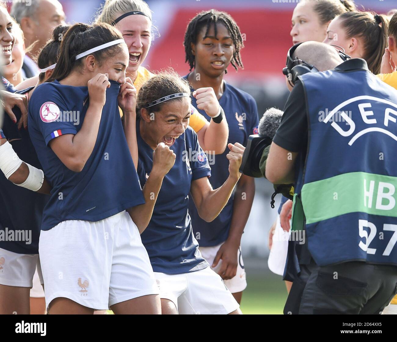French players celebrate in front of the TV cameras after the final ...