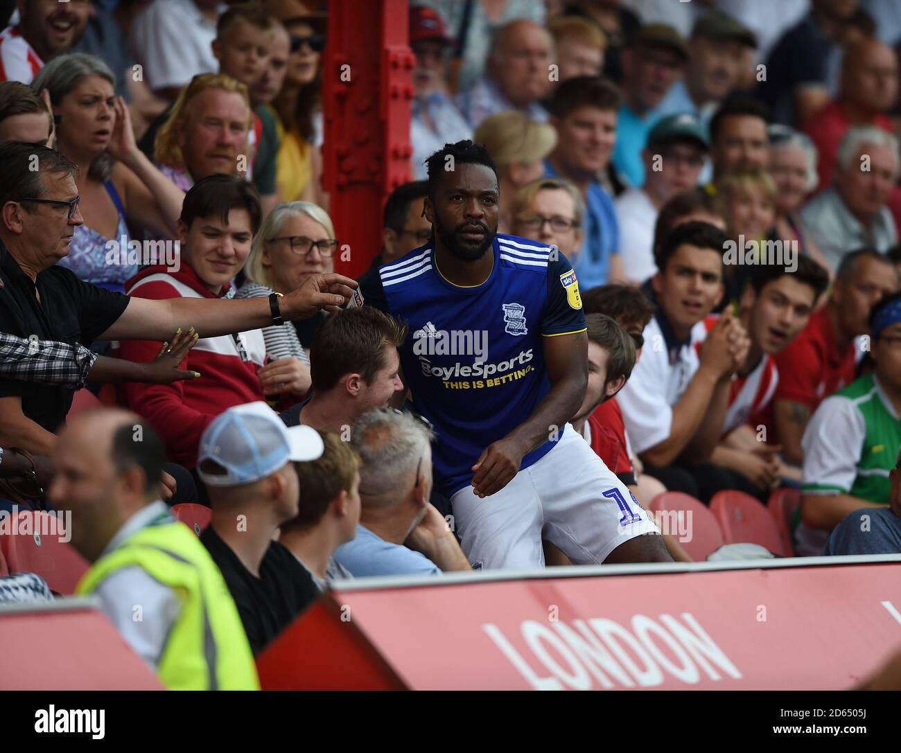 Birmingham City's Kerim Mrabti is forced into the crowd by a shoulder ...