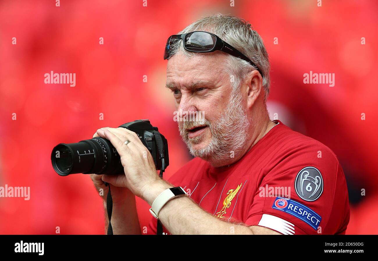 A Liverpool fan takes a photograph Stock Photo - Alamy