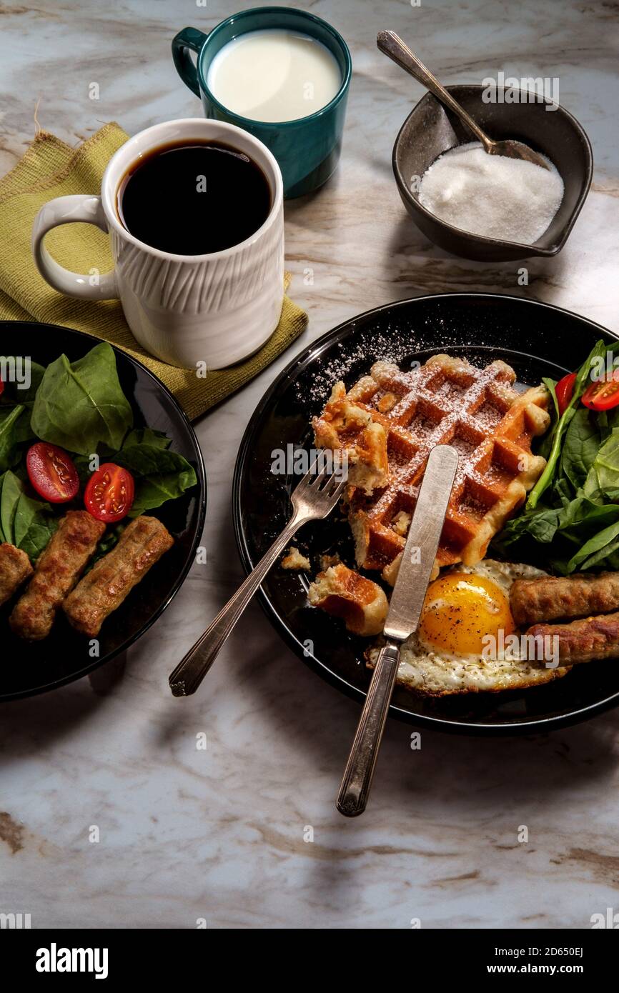 Belgian waffle breakfast served with sausage eggs and coffee Stock ...
