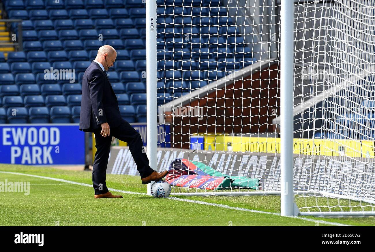 Match referee Andy Woolmer tests the goal line technology before kick ...