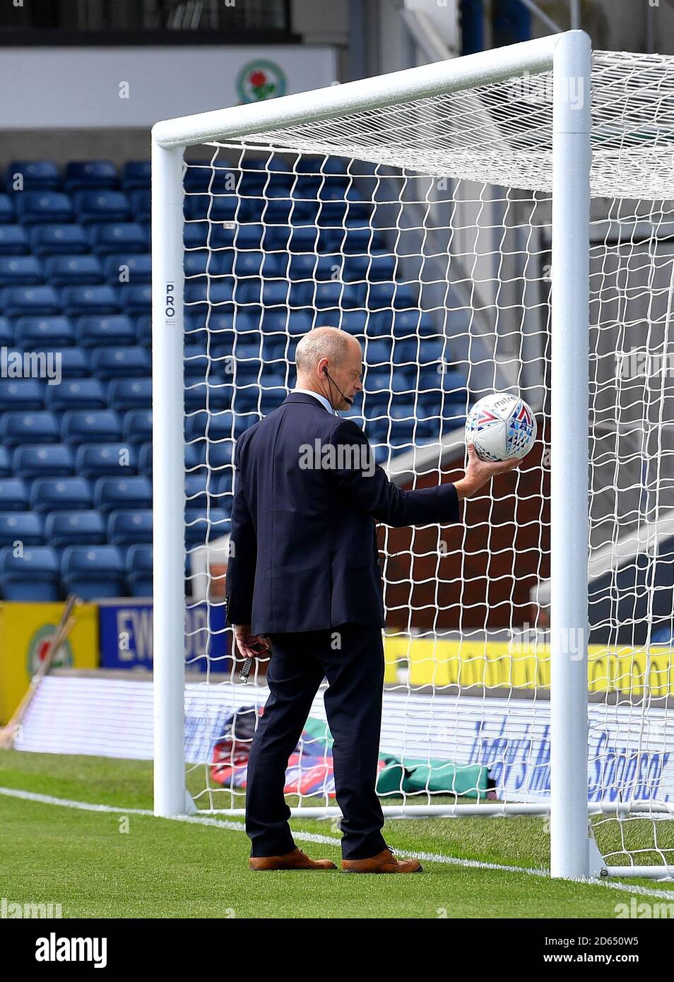 Match referee Andy Woolmer tests the goal line technology before kick ...