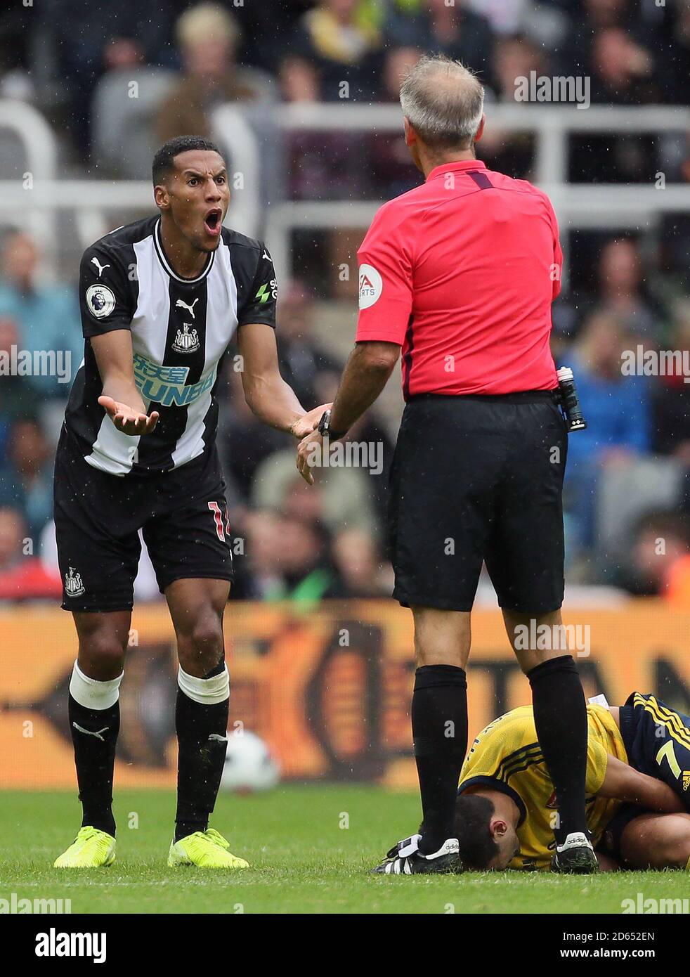 Newcastle United's Isaac Hayden has words with referee Martin Atkinson ...
