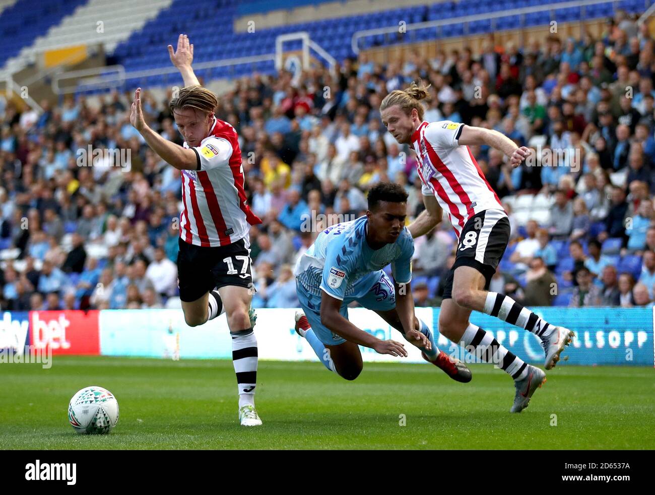 Exeter City's Matt Jay (left) and Alex Fisher take on Coventry City's ...