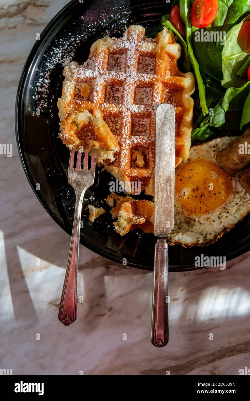 Belgian waffle breakfast served with sausage eggs and coffee Stock ...