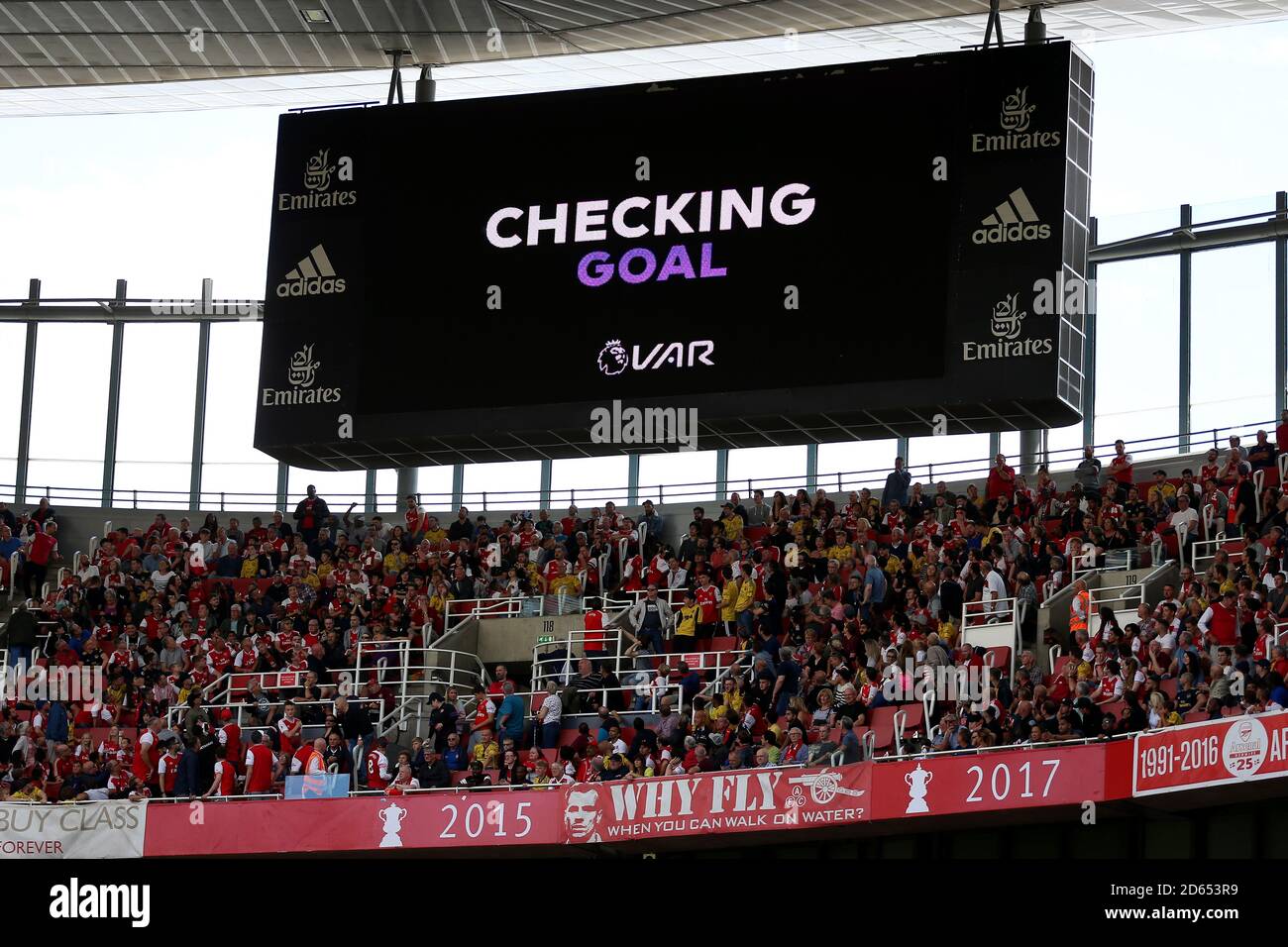 The big screen shows the VAR checking to confirm that Arsenal's Reiss ...