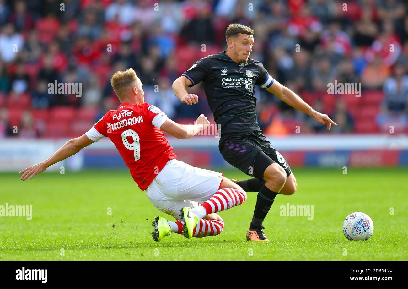 Barnsley's Cauley Woodrow (left) and Charlton Athletic's Jason Pearce ...