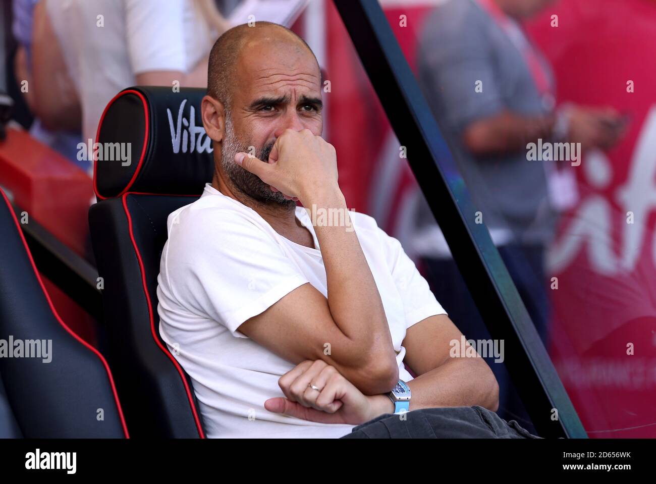 Manchester City manager Pep Guardiola on the bench before the match ...