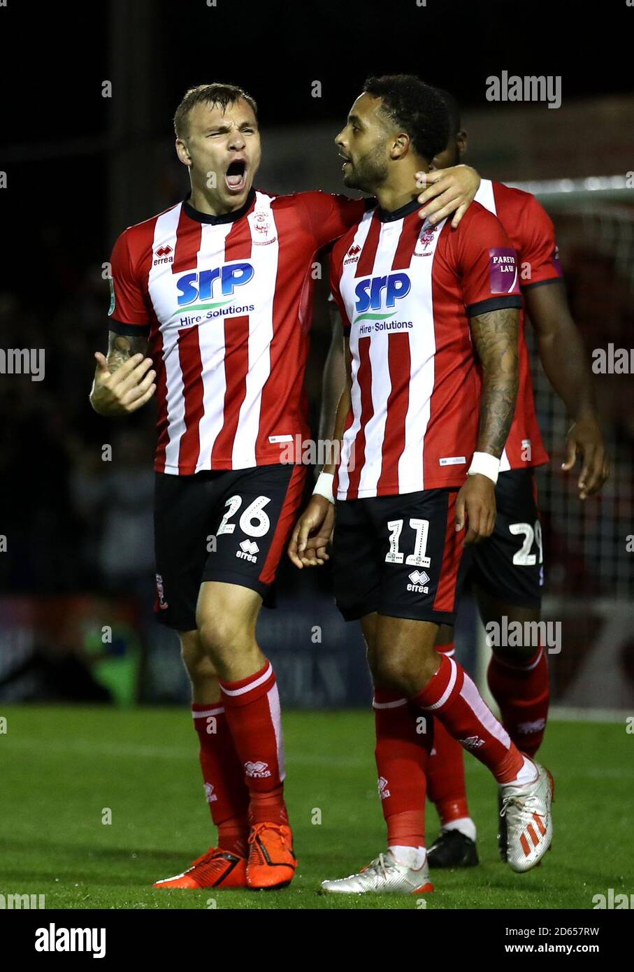 Lincoln City'ss Bruno Andrade (right) celebrates scoring his side's ...