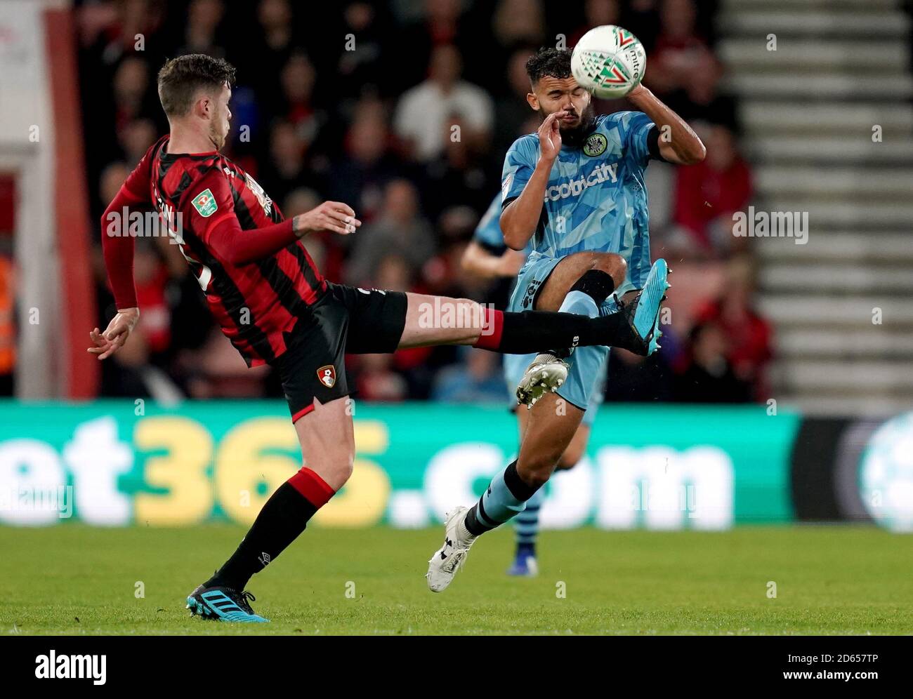 Forest Green Rovers' Dominic Bernard, (right) is tackled by Bournemouth ...