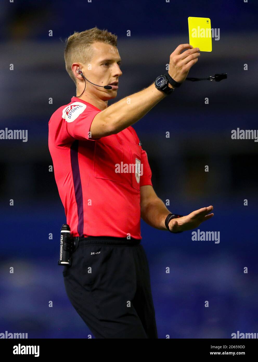 Referee Will Finnie shows Walsall's Cameron Pring the yellow card Stock ...