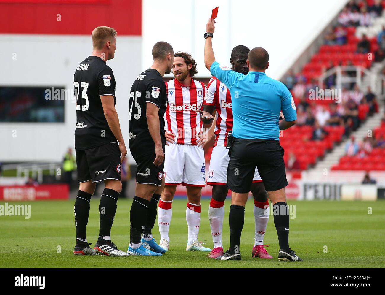 Stoke City's Joe Allen (centre) is shown a red card by referee Geoff ...