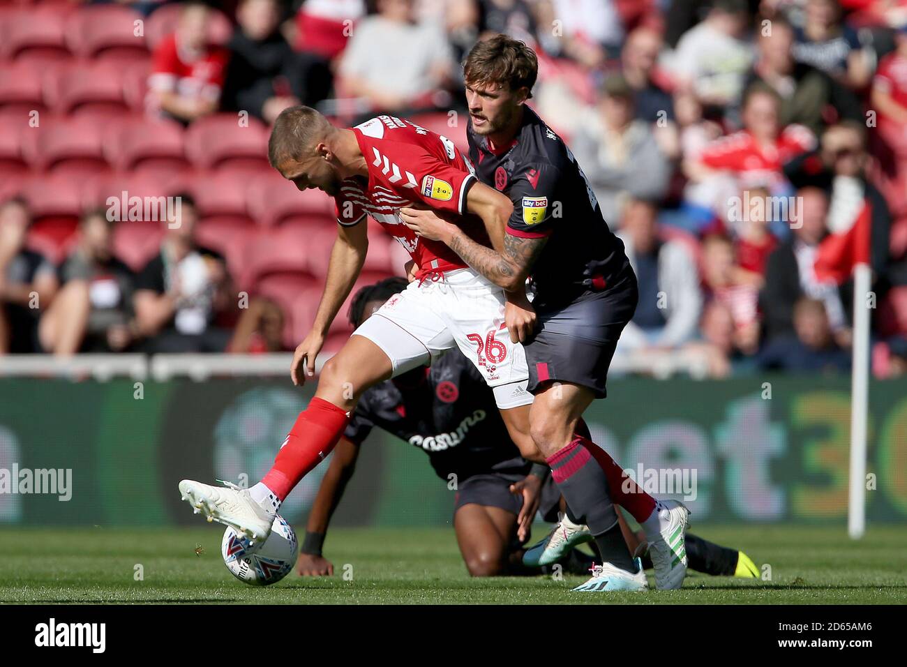 Middlesbrough's Lewis Wing (centre) and Reading's John Swift battle for ...