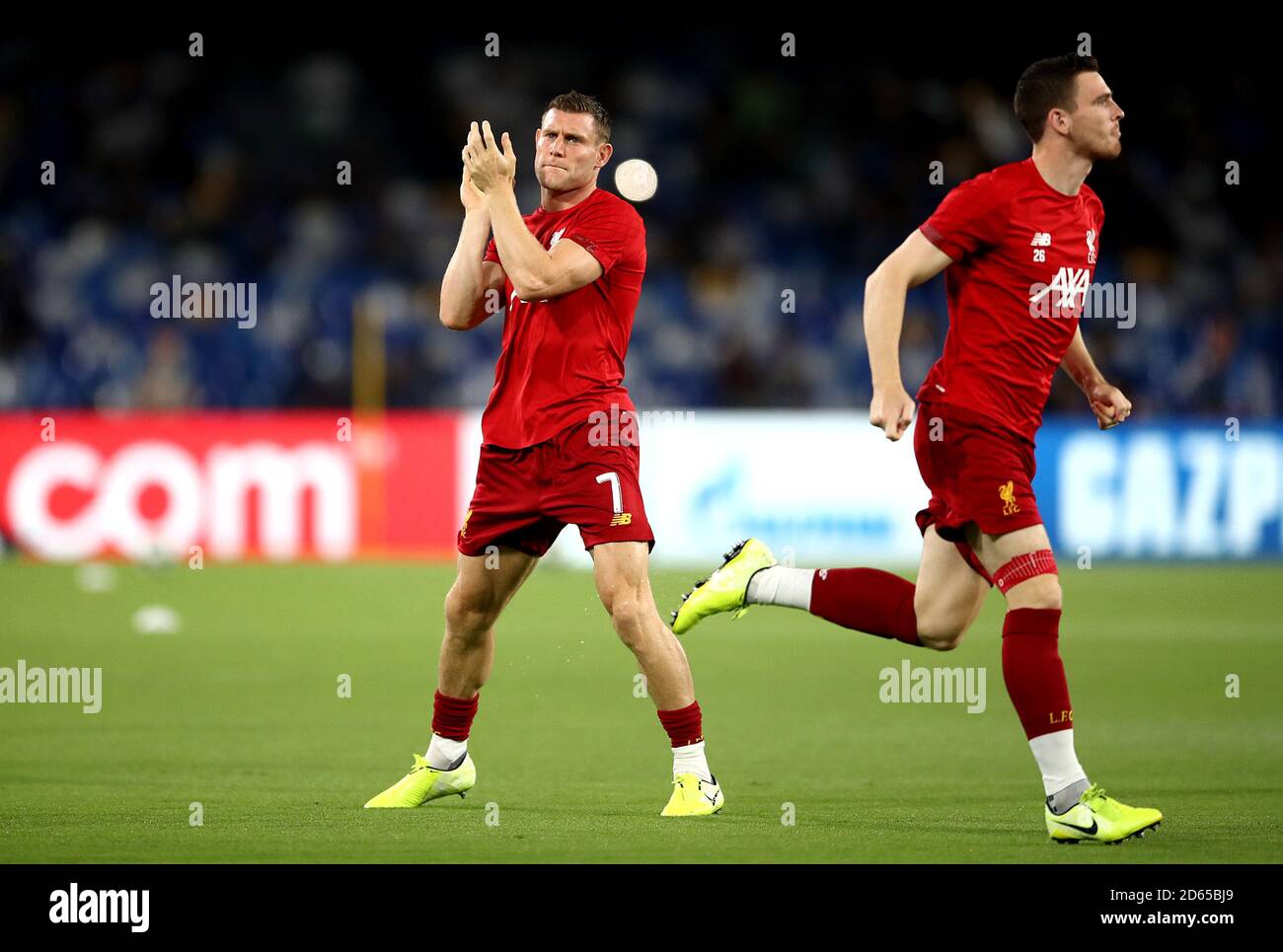Liverpool's James Milner (left) warms-up before kick-off Stock Photo ...