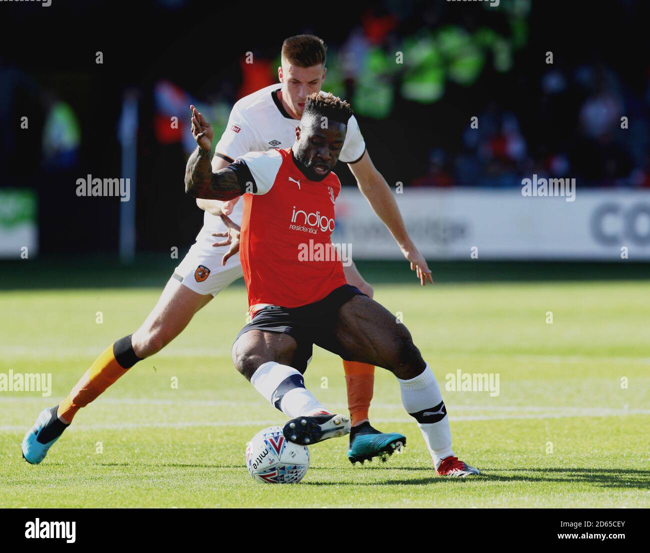 Luton Town's Kazenga LuaLua (right) anf Hull City's Reece Burke (left ...